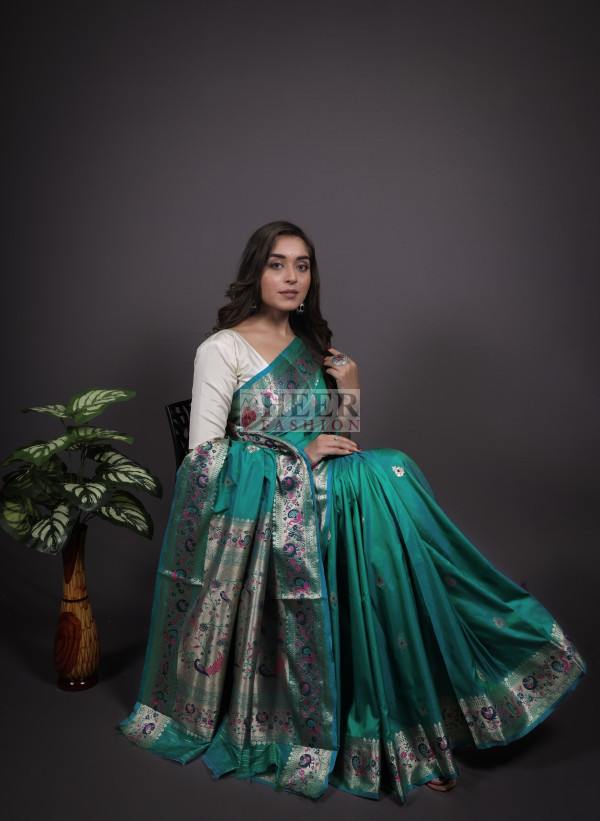 Rama green color paithani silk saree with zari weaving work