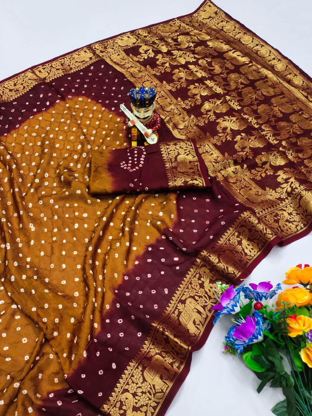 Beige and maroon hand bandhej bandhani saree with zari weaving border
