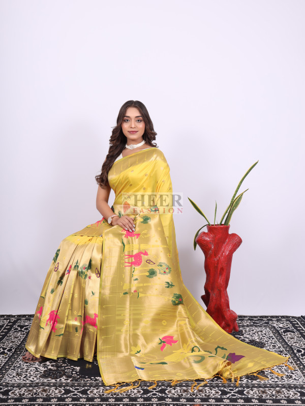 Yellow color paithani silk saree with zari weaving work