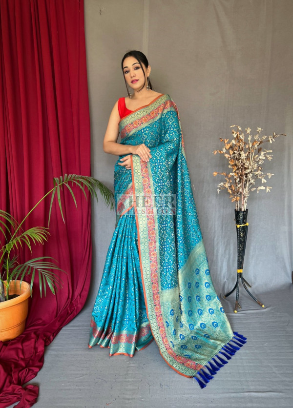 Rama green color patola silk saree with woven design