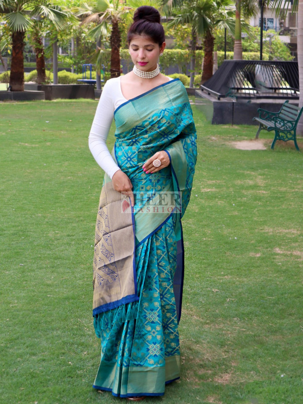 Rama green color patola silk saree with woven design