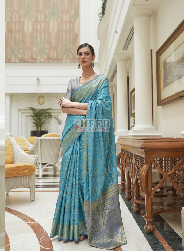 Rama green color patola silk saree with woven design