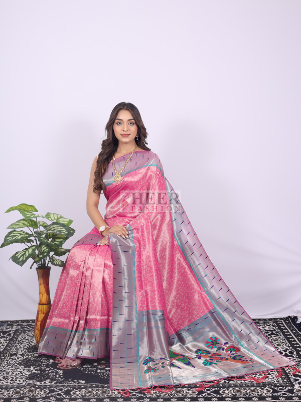 Pink color tissue silk saree with zari weaving work