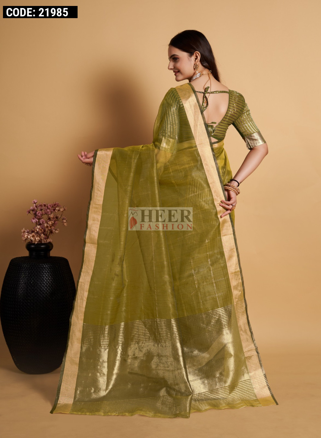 Mahendi green color organza silk saree with zari weaving work