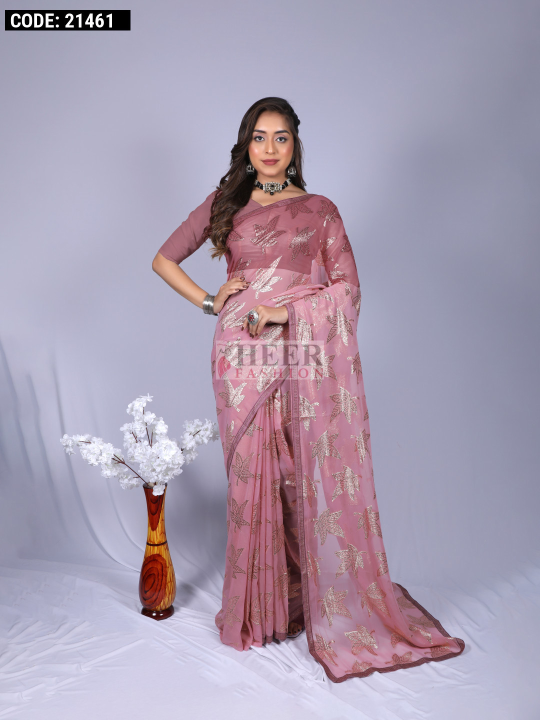 Baby pink color soft georgette saree with zari weaving work