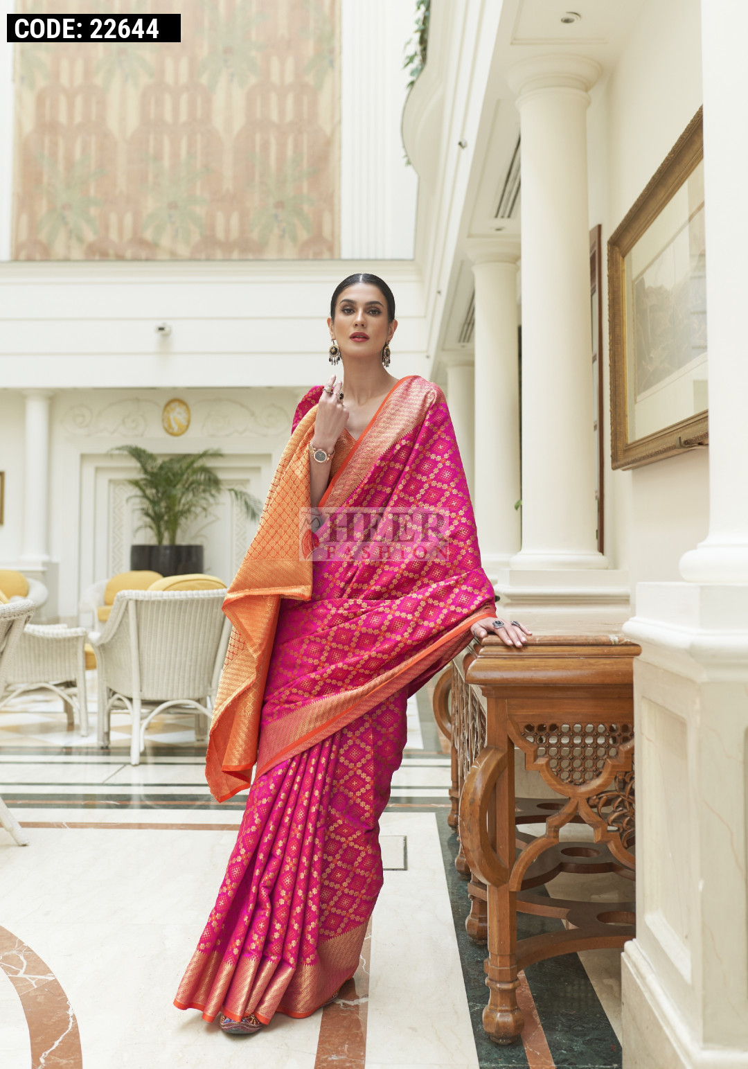 Rani pink color patola silk saree with woven design