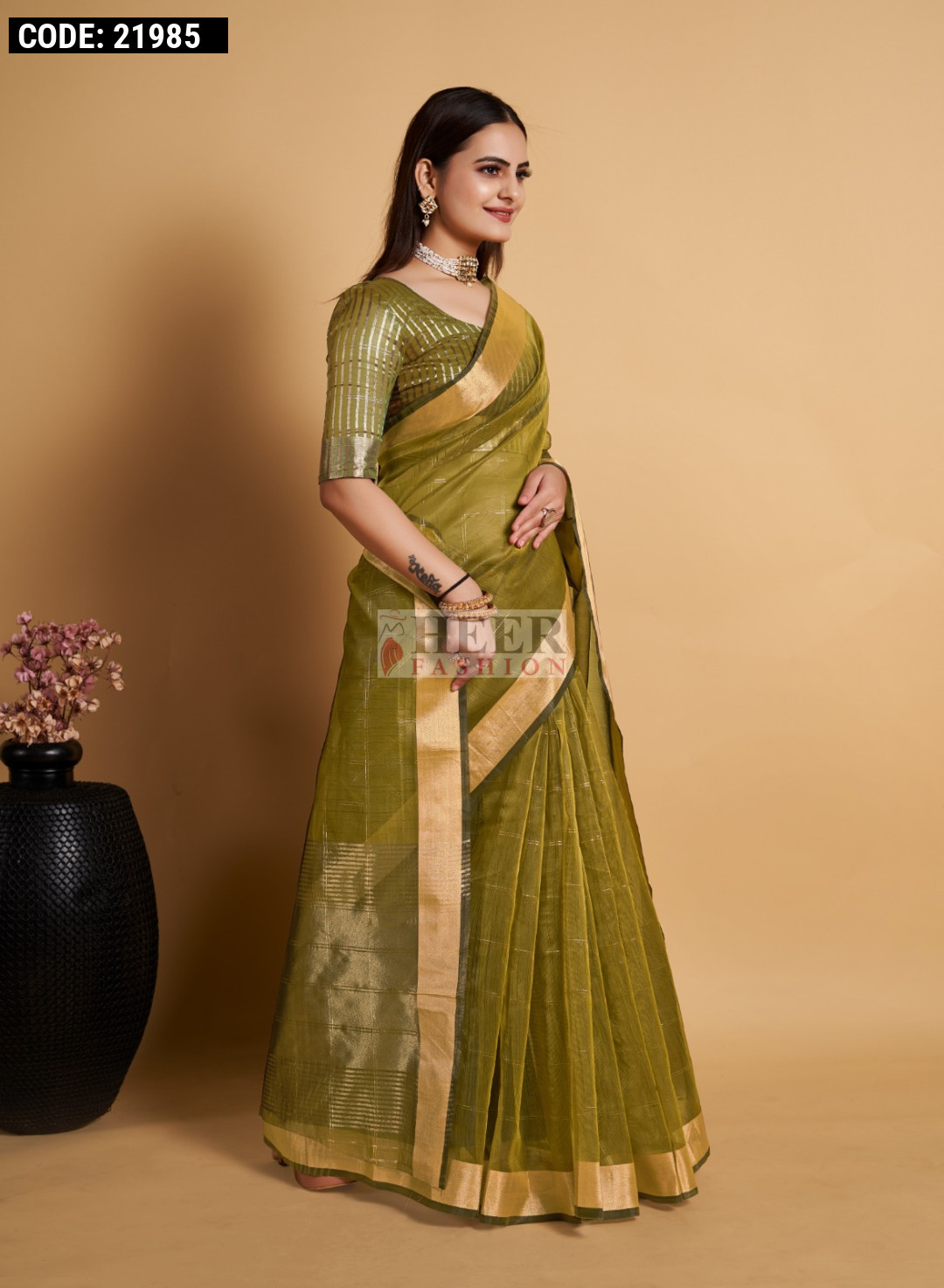 Mahendi green color organza silk saree with zari weaving work