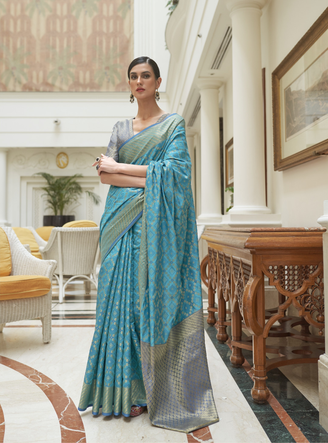 Rama green color patola silk saree with woven design