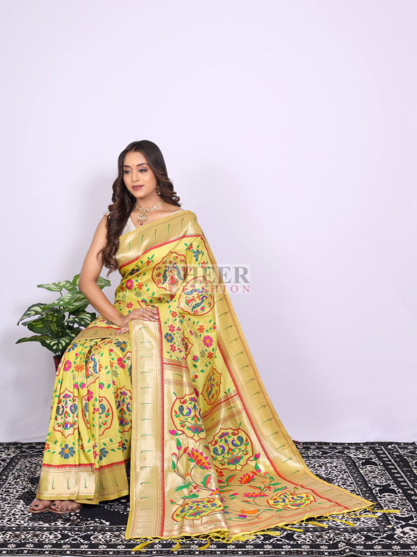 Yellow color paithani silk saree with zari weaving work