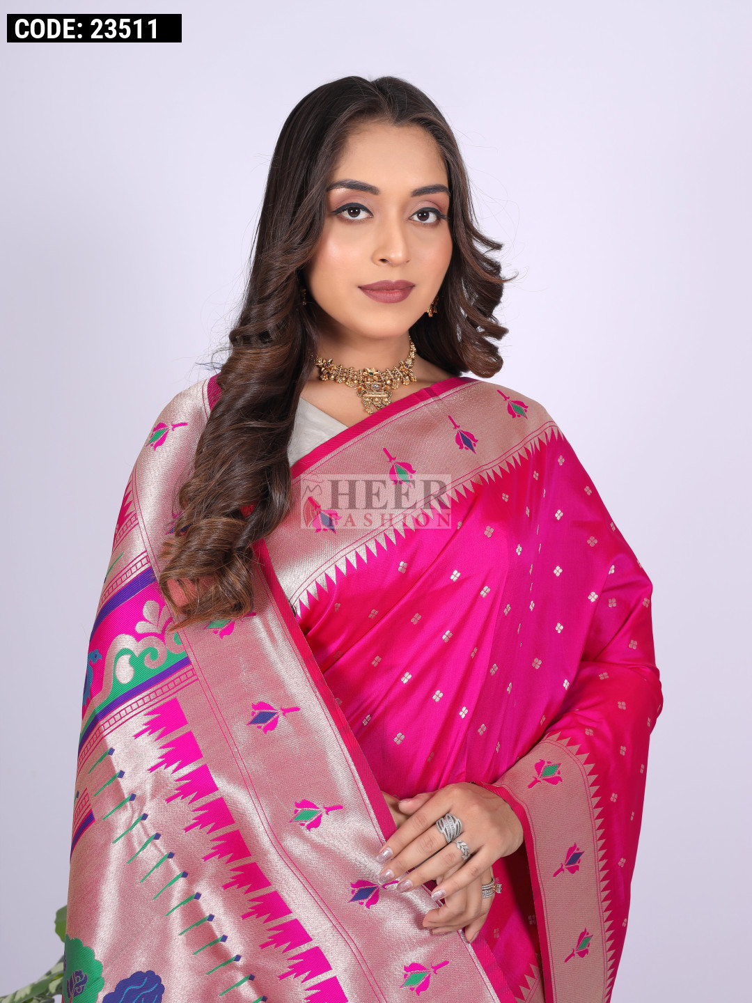 Rani pink color paithani silk saree with zari weaving work
