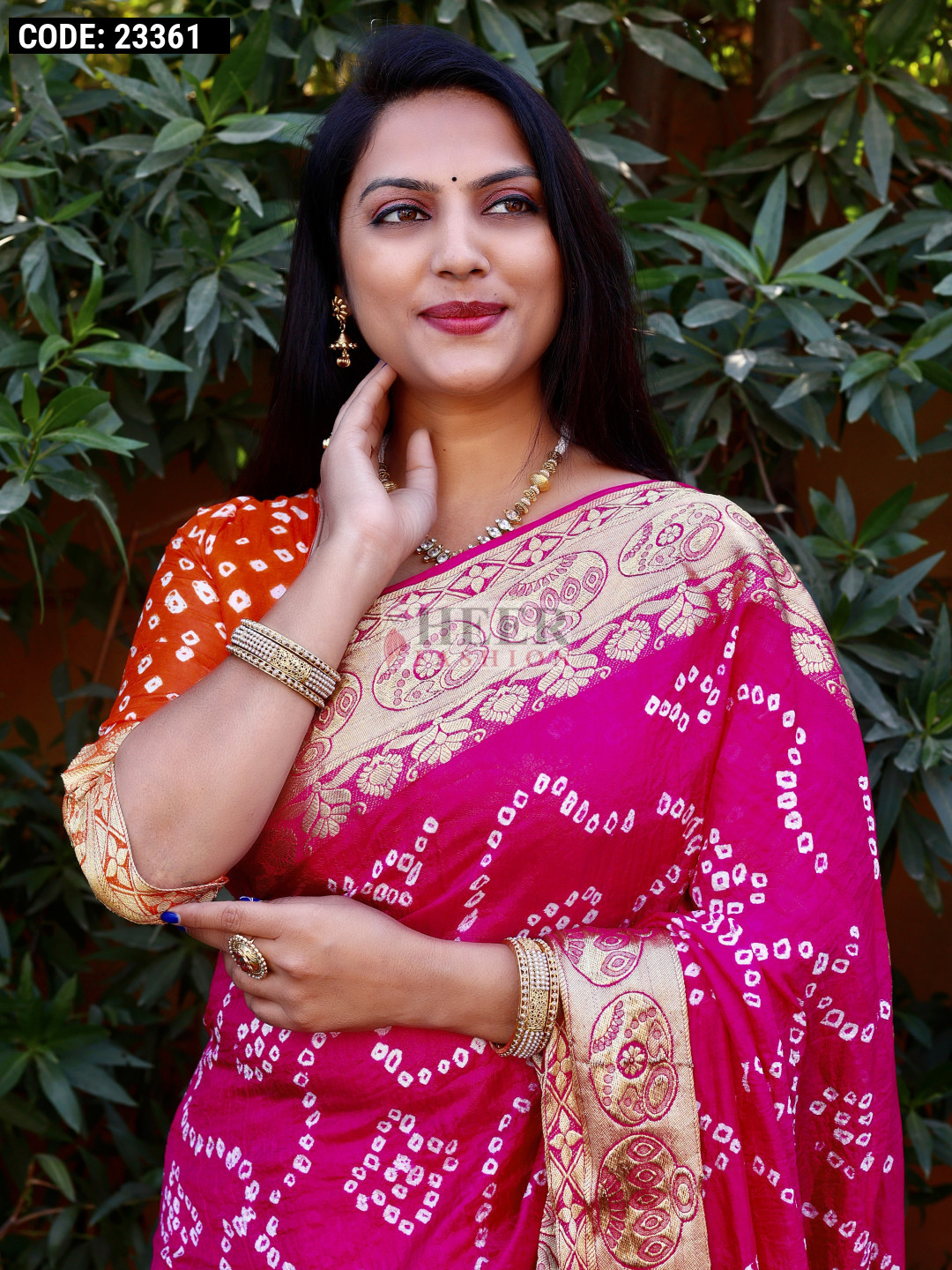 Rani pink color bandhani silk saree with hand bandhej work