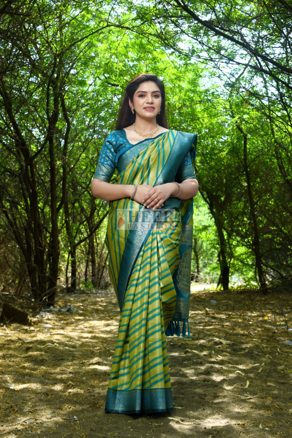 Green color soft leheriya silk saree with zari weaving work