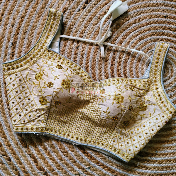 Fancy embroidery design work off white color blouse