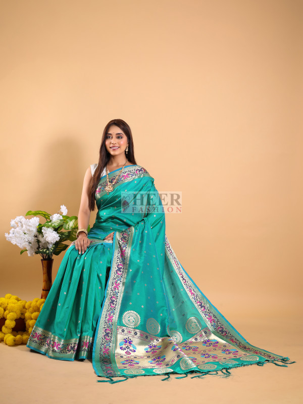 Rama green color paithani silk saree with zari weaving work