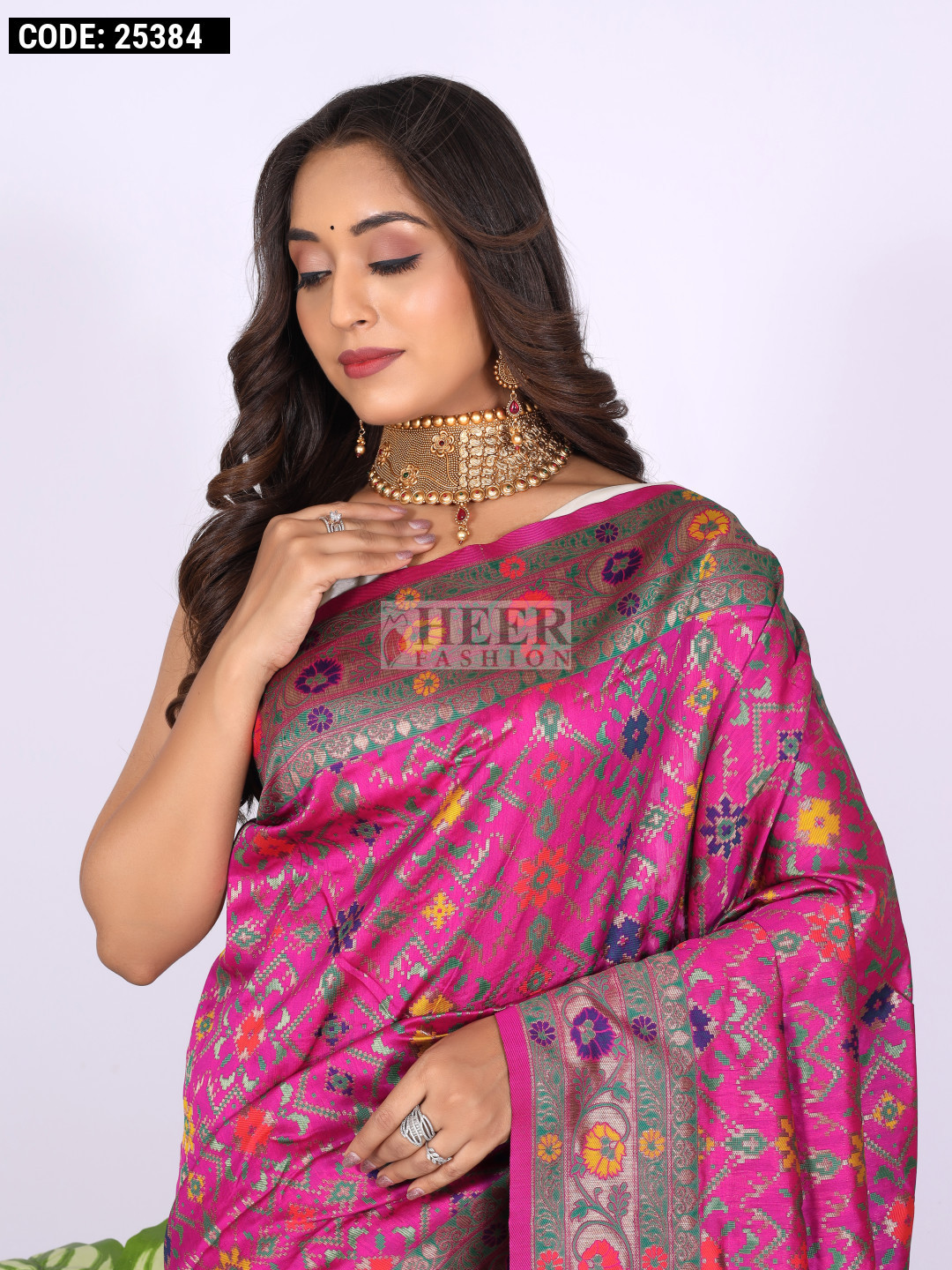Rani pink color patola silk saree with woven design