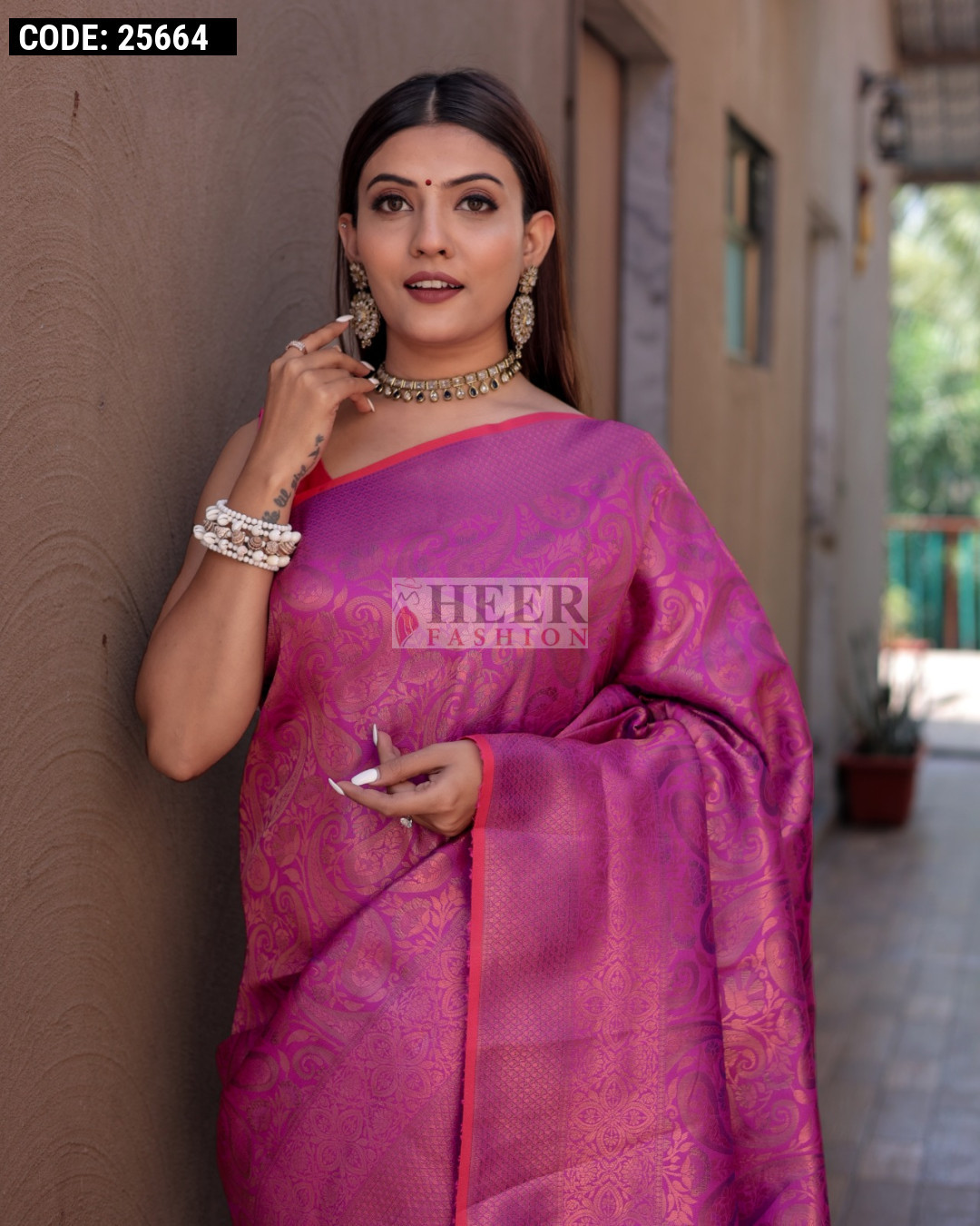 Rani pink color kanchipuram silk saree with zari woven work