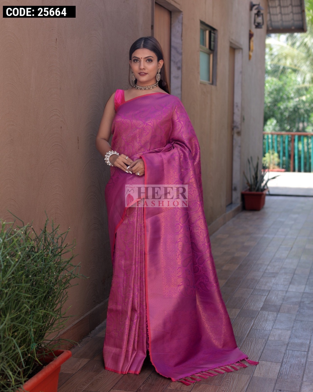 Rani pink color kanchipuram silk saree with zari woven work