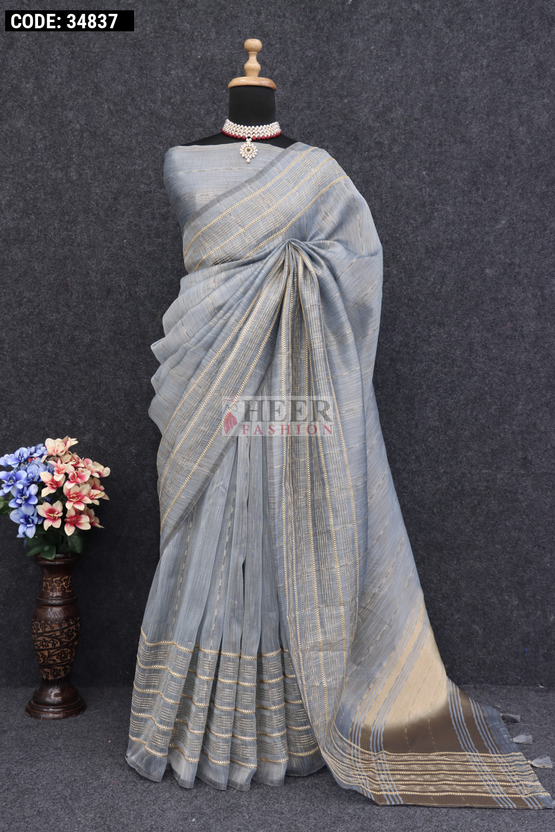 Gray color tussar silk saree with zari weaving work