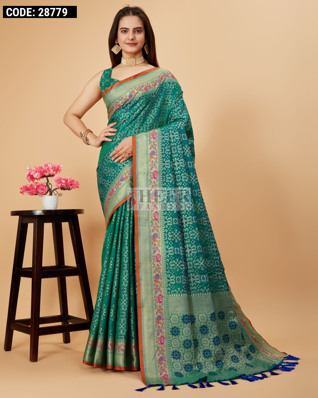 Rama green color patola silk saree with woven design