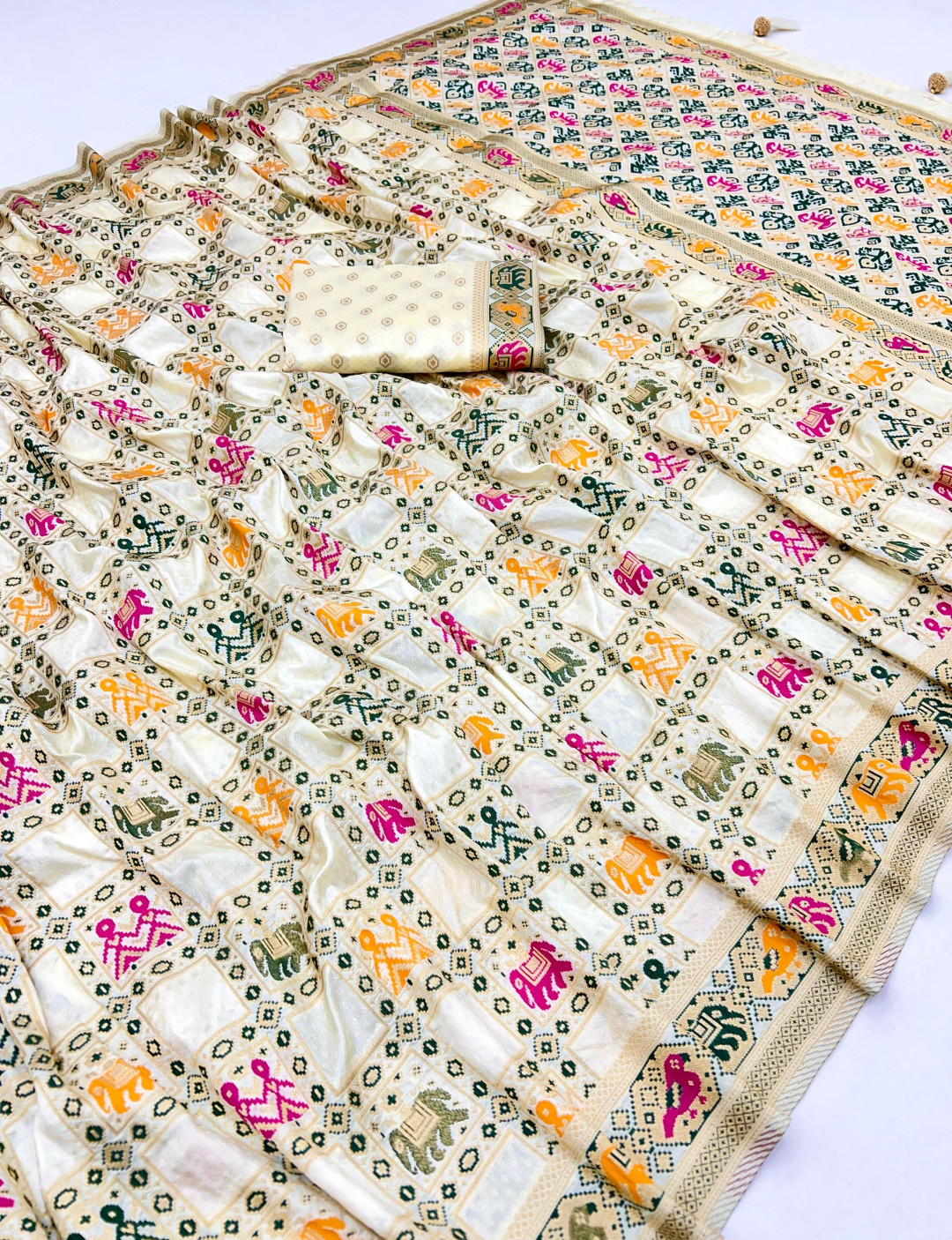Off white traditional patola silk saree with meenakari zari weaving work