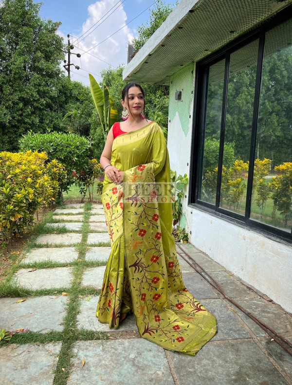 Mahendi green color paithani silk saree with zari weaving work