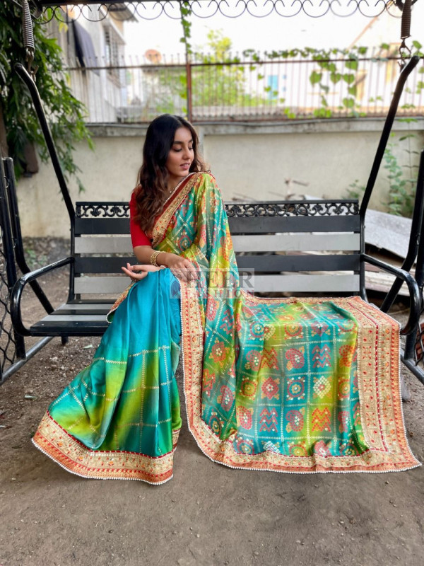 Firoji color dola silk saree with printed and sequence work