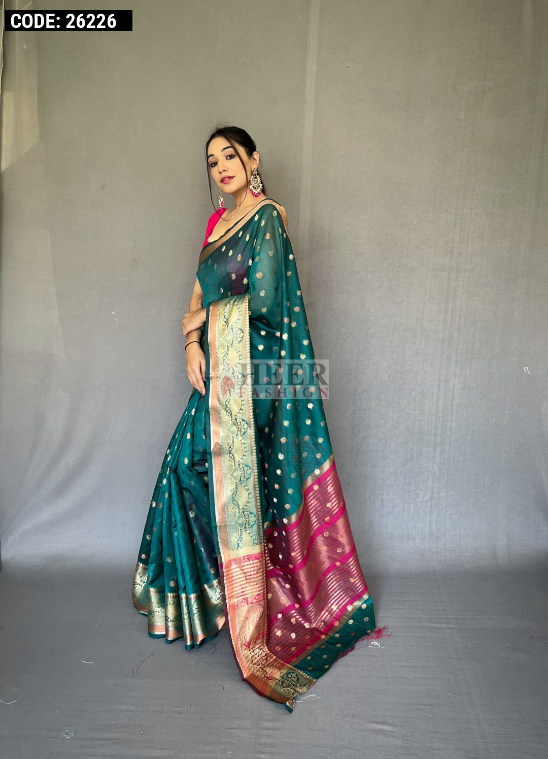 Rama green color organza silk saree with zari weaving work