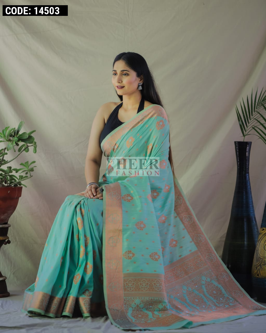 Sea green color tussar silk saree with golden zari weaving work