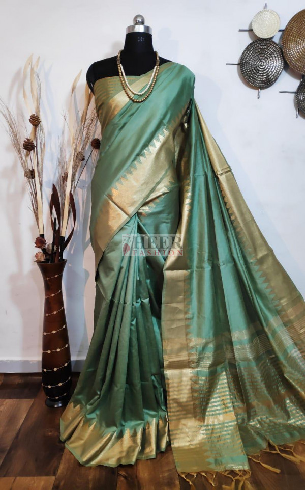 Rama green color aasam silk saree with zari weaving work