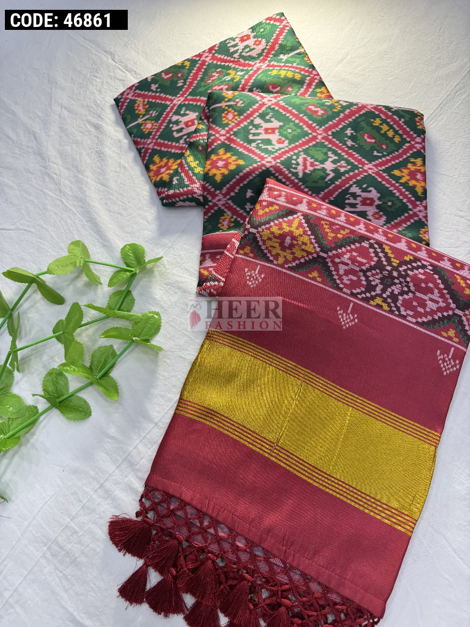 Green patola silk saree with double ikkat printed work