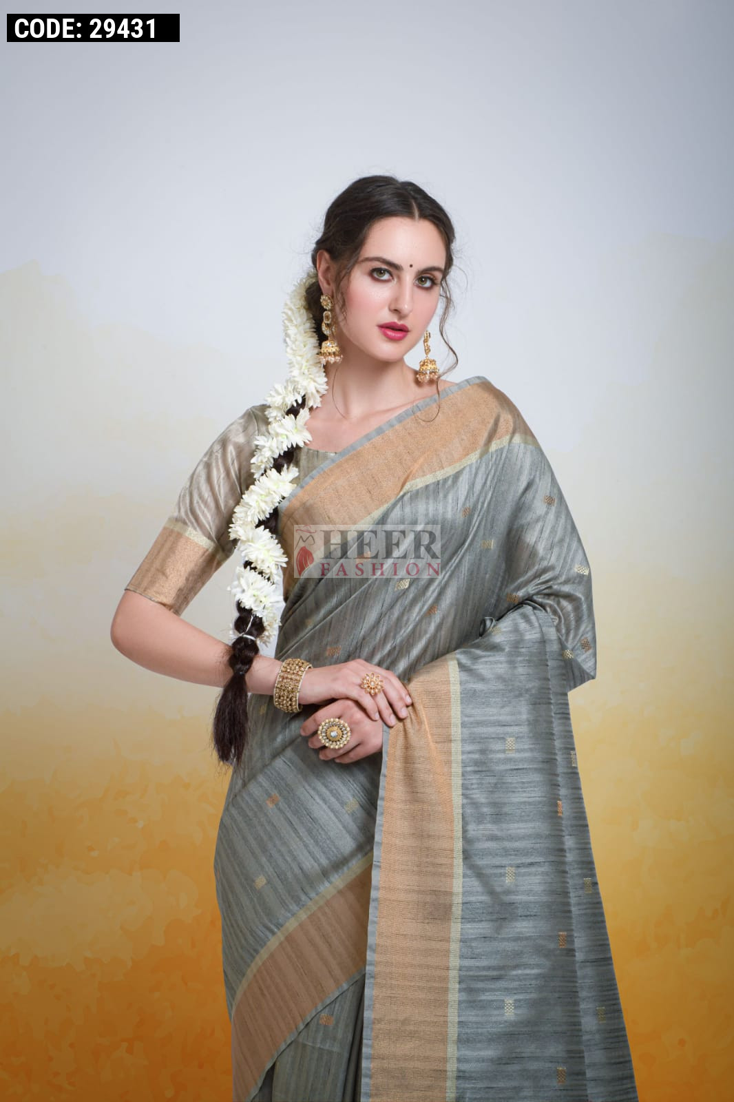Gray color tussar silk saree with zari woven work