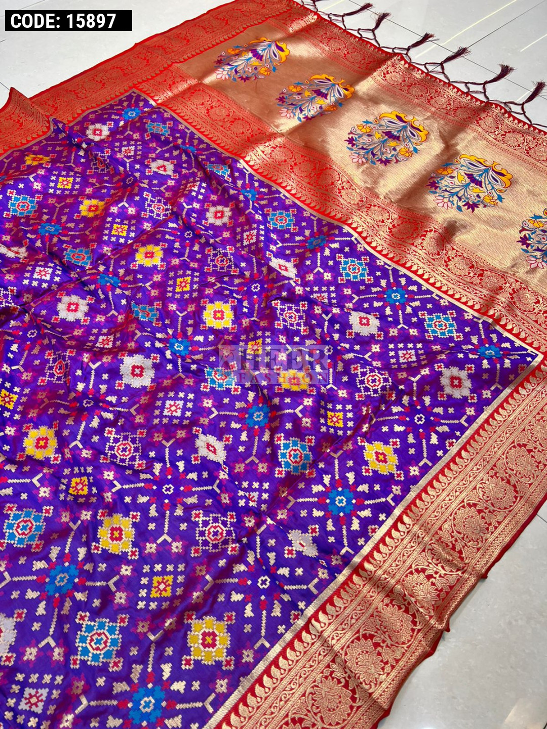 Purple color patola silk saree with zari weaving work