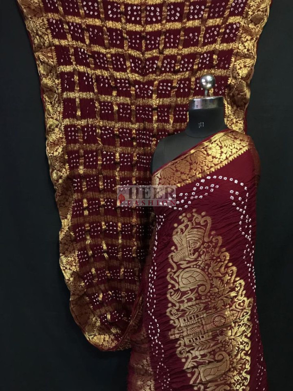 Maroon color pure hand bandhej bandhani saree with zari weaving work