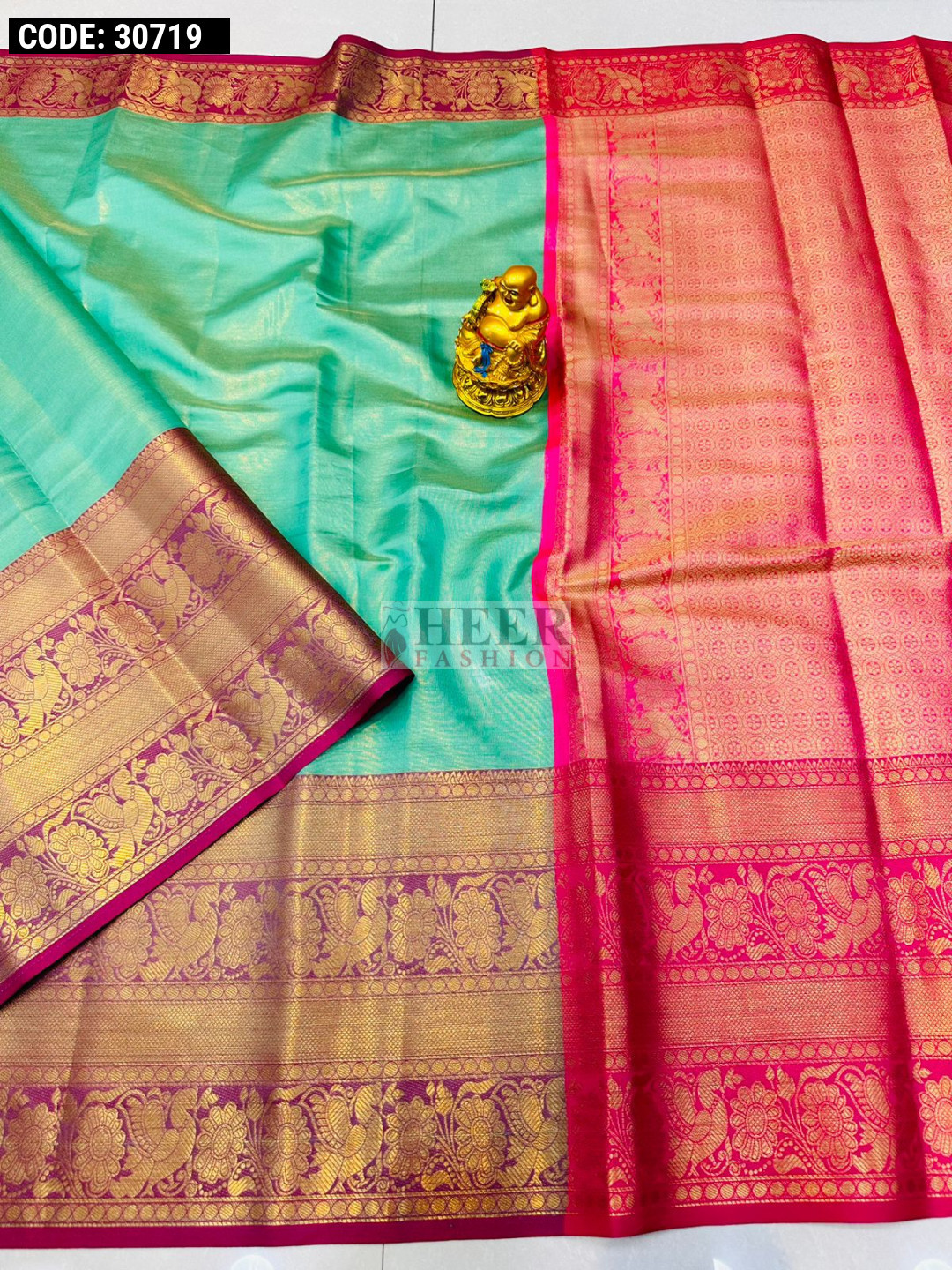 Sea green color kanchipuram silk saree with zari weaving work