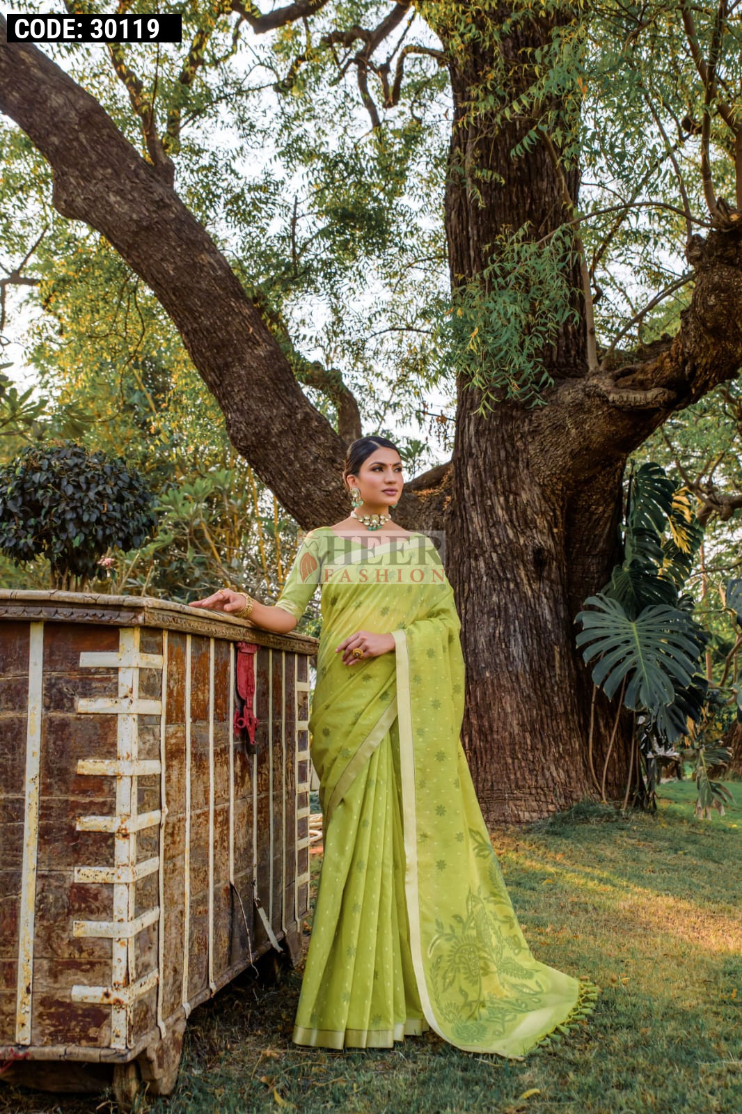 Mahendi green color linen silk saree with woven design
