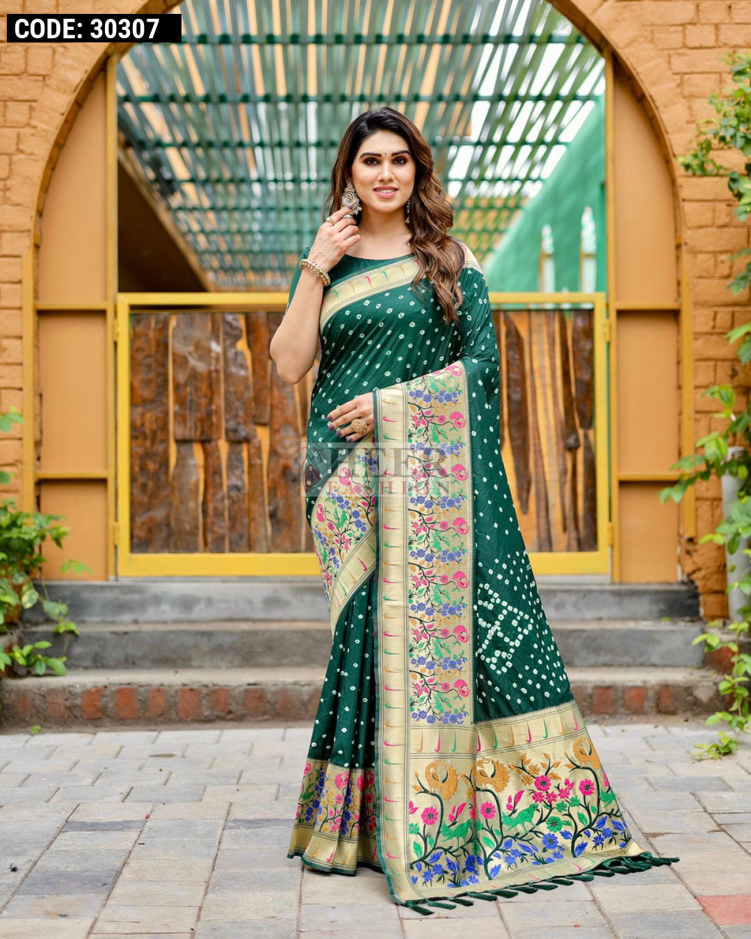 Bottle green color bandhej silk saree with zari weaving work