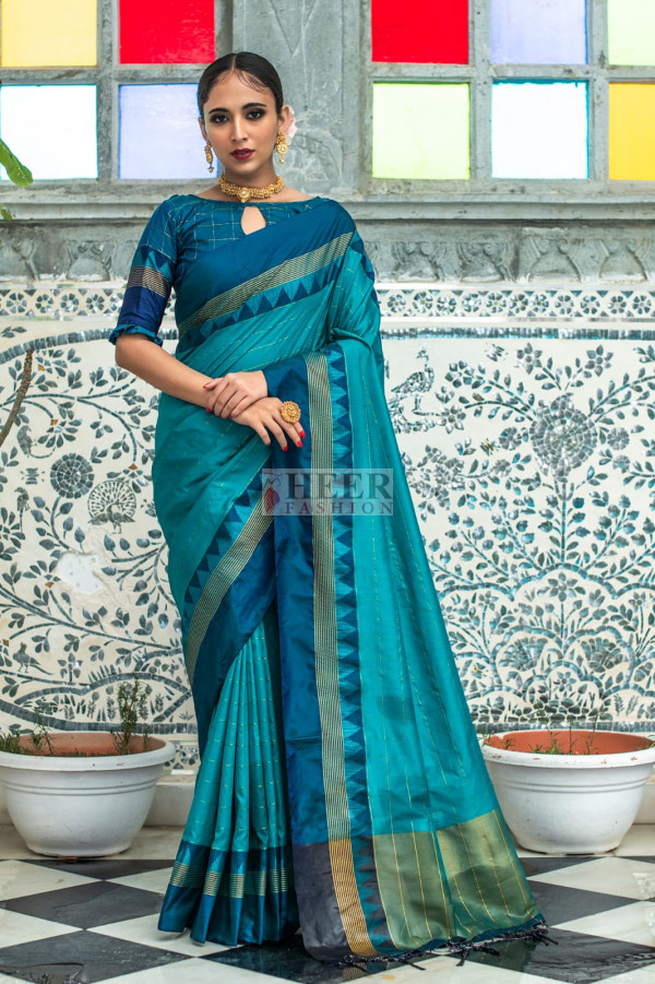 Rama green color soft raw silk saree with zari woven work