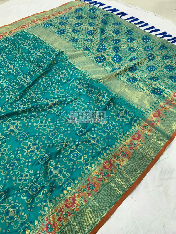 Rama green color patola silk saree with woven design