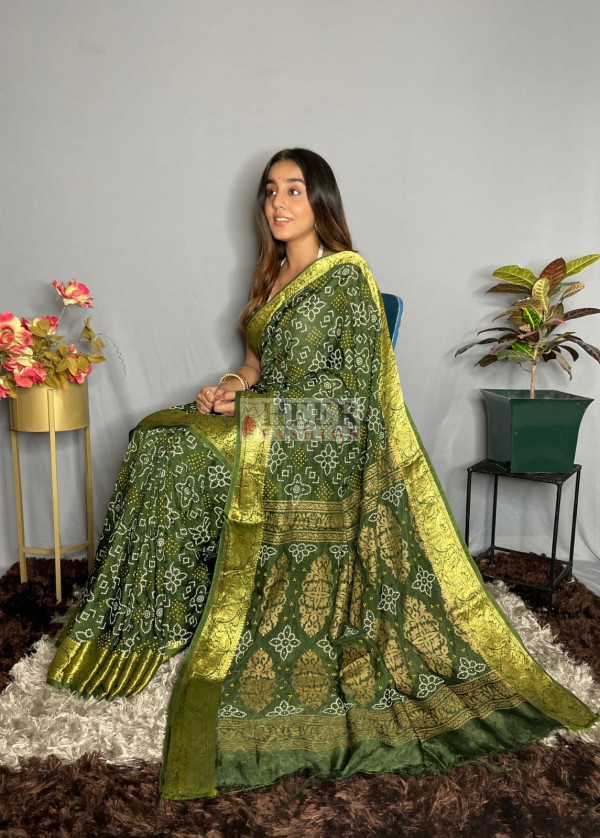 Mahendi green color bandhani silk saree with zari weaving work
