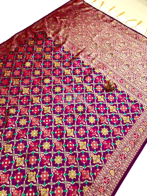 Magenta color patola silk saree with zari weaving work
