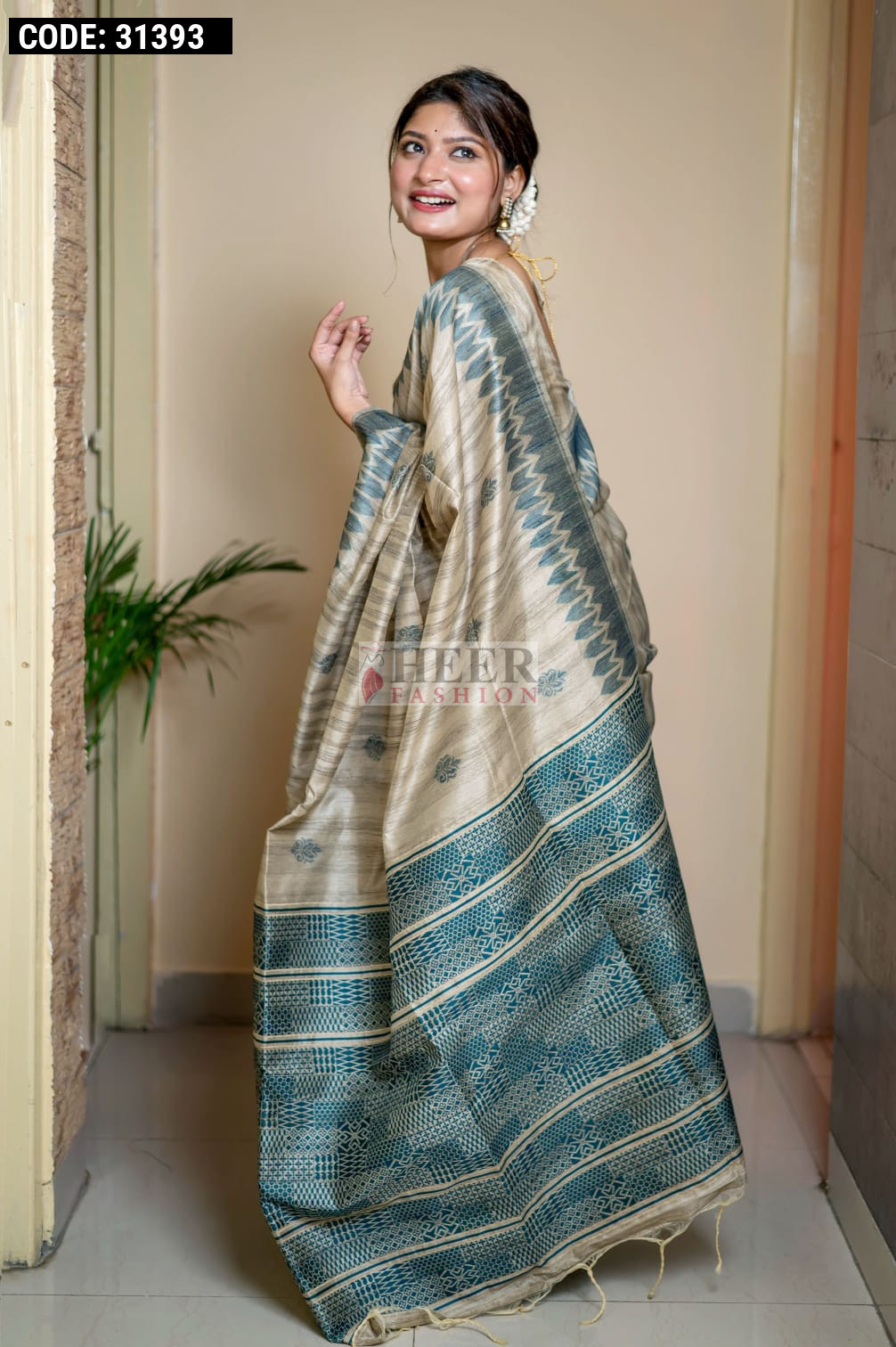 Beige and rama green color tussar silk saree with woven design