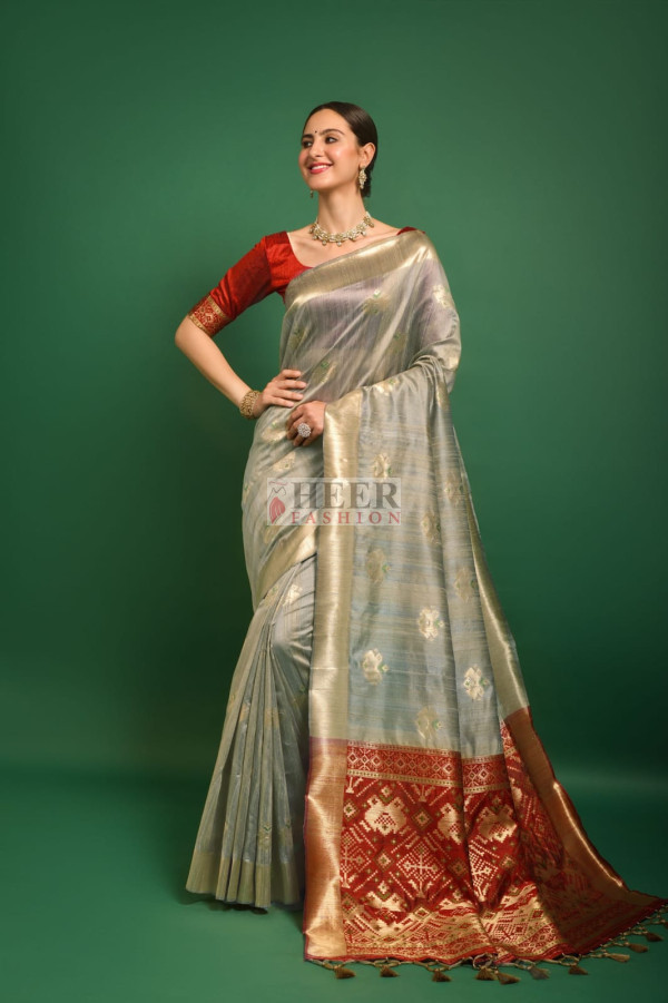 Beige color tussar silk saree with woven design
