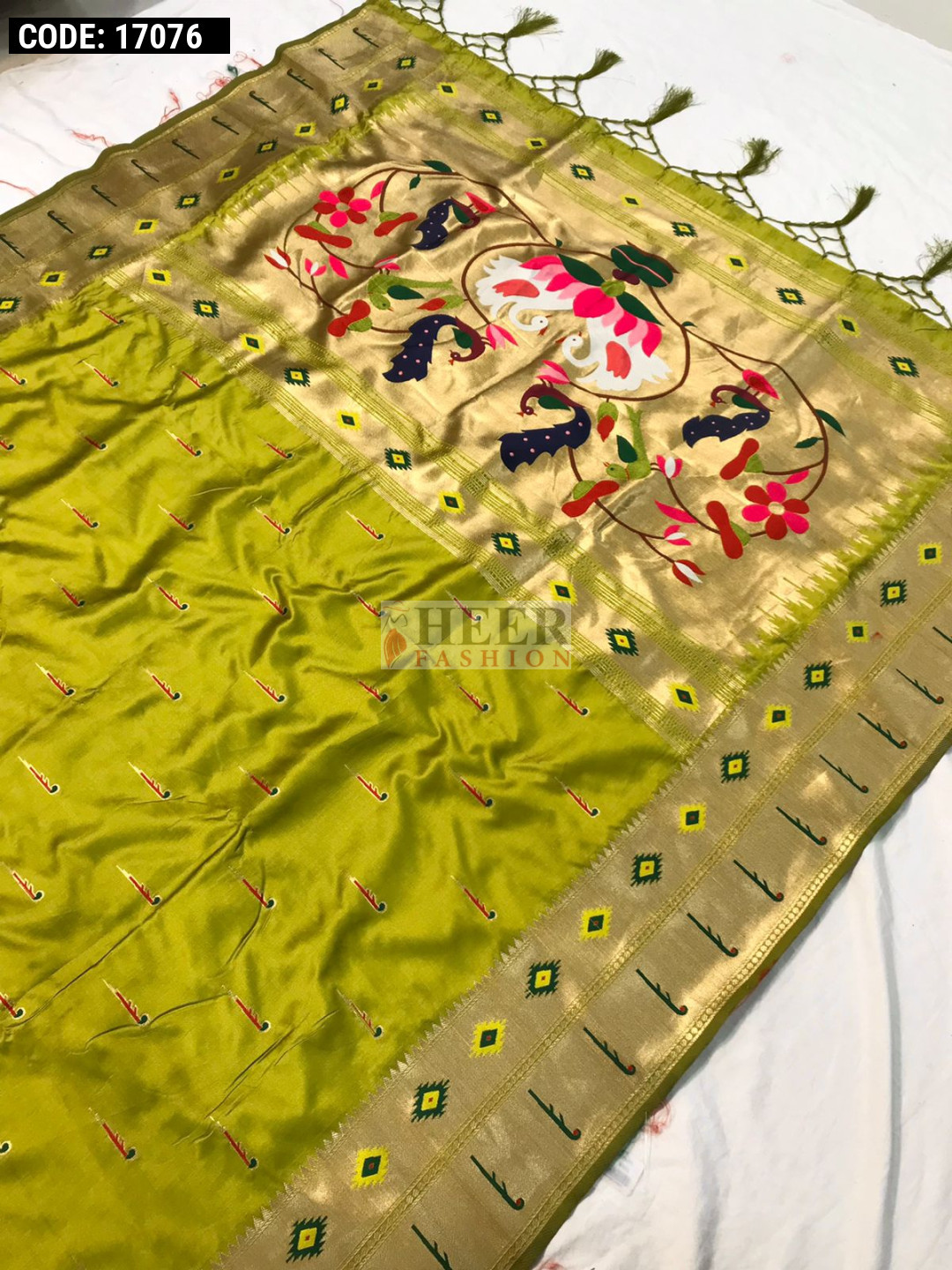 Mehndi green color paithani silk saree with zari weaving work
