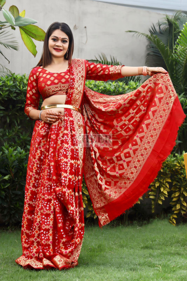 Red color hand bandhej silk saree with zari weaving work