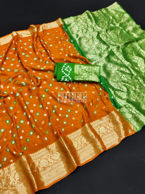 Orange color hand bandhej silk saree with zari weaving work