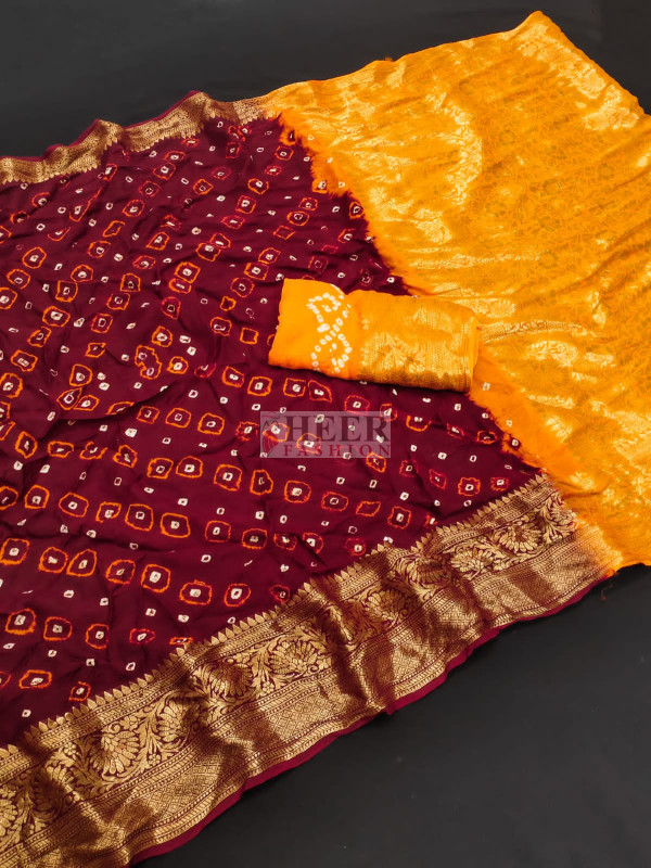 Maroon color hand bandhej silk saree with zari weaving work