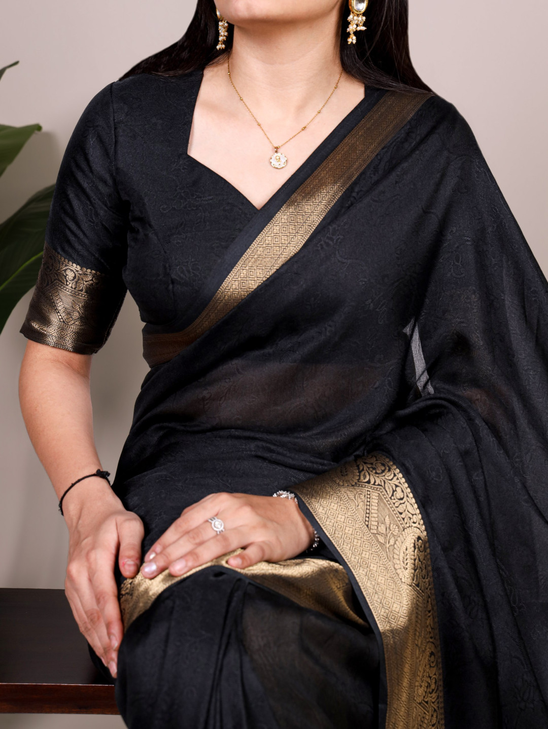 Black soft mass mello silk saree with printed work and zari weaving border