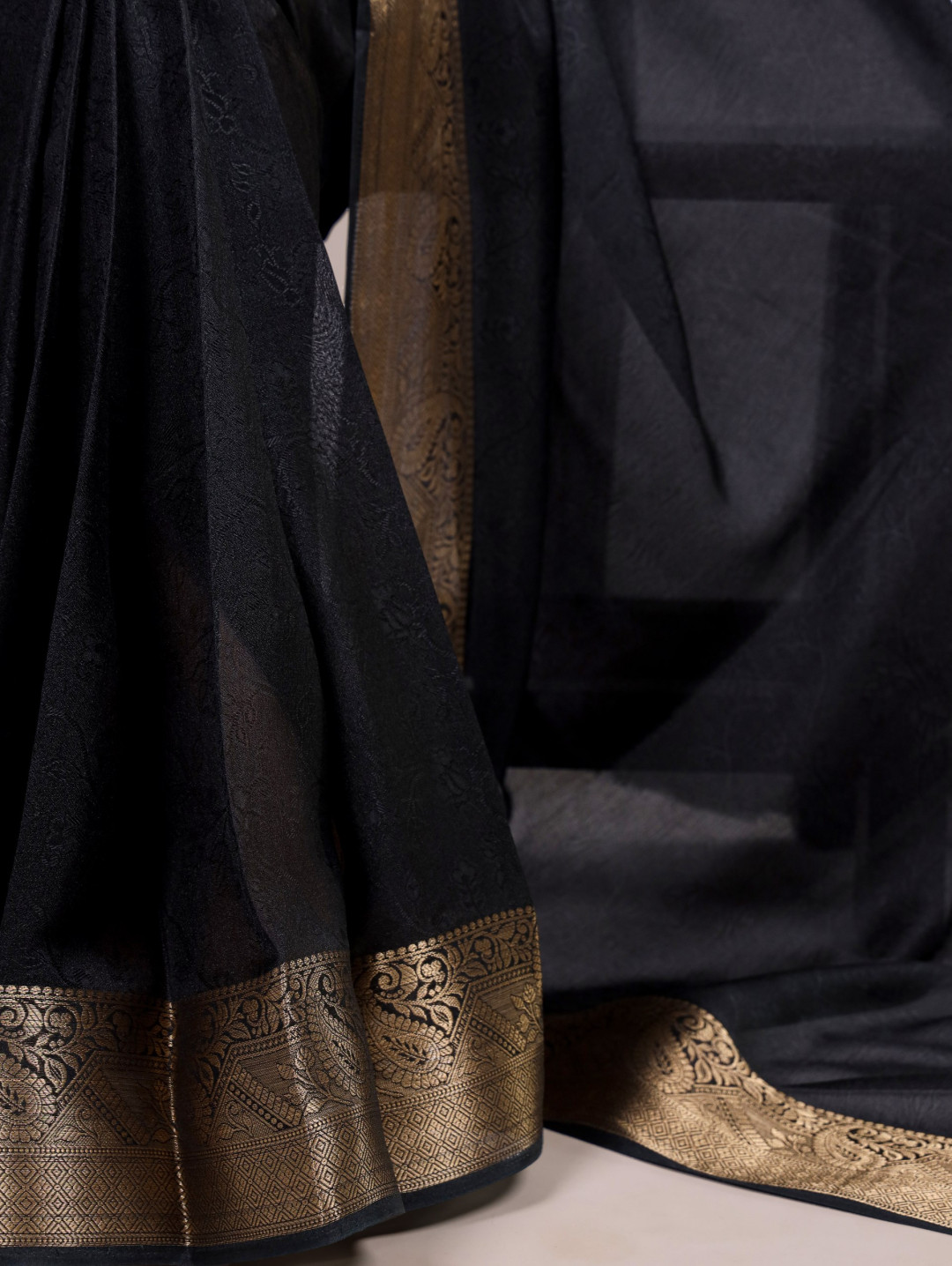 Black soft mass mello silk saree with printed work and zari weaving border