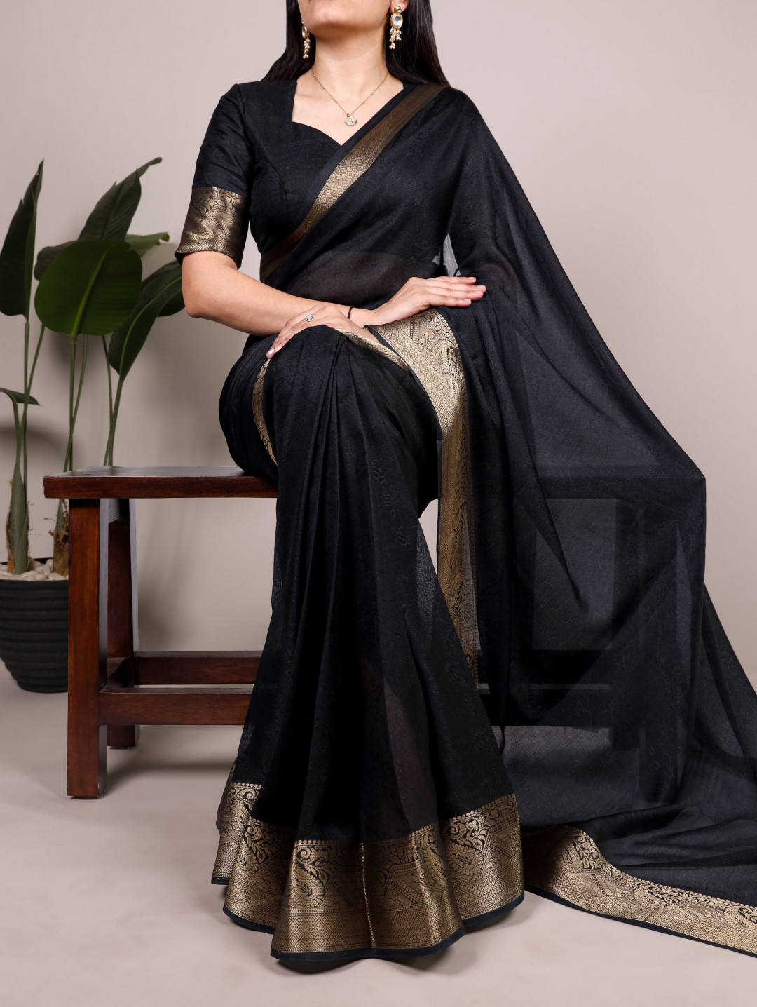 Black soft mass mello silk saree with printed work and zari weaving border