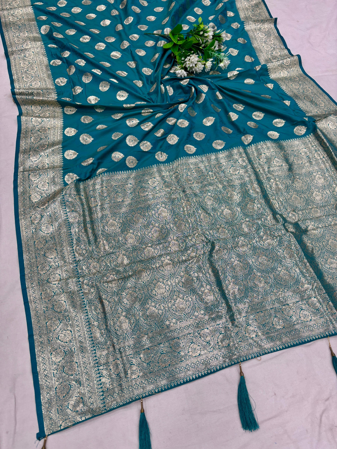 Rama green color banarasi silk saree with zari weaving work